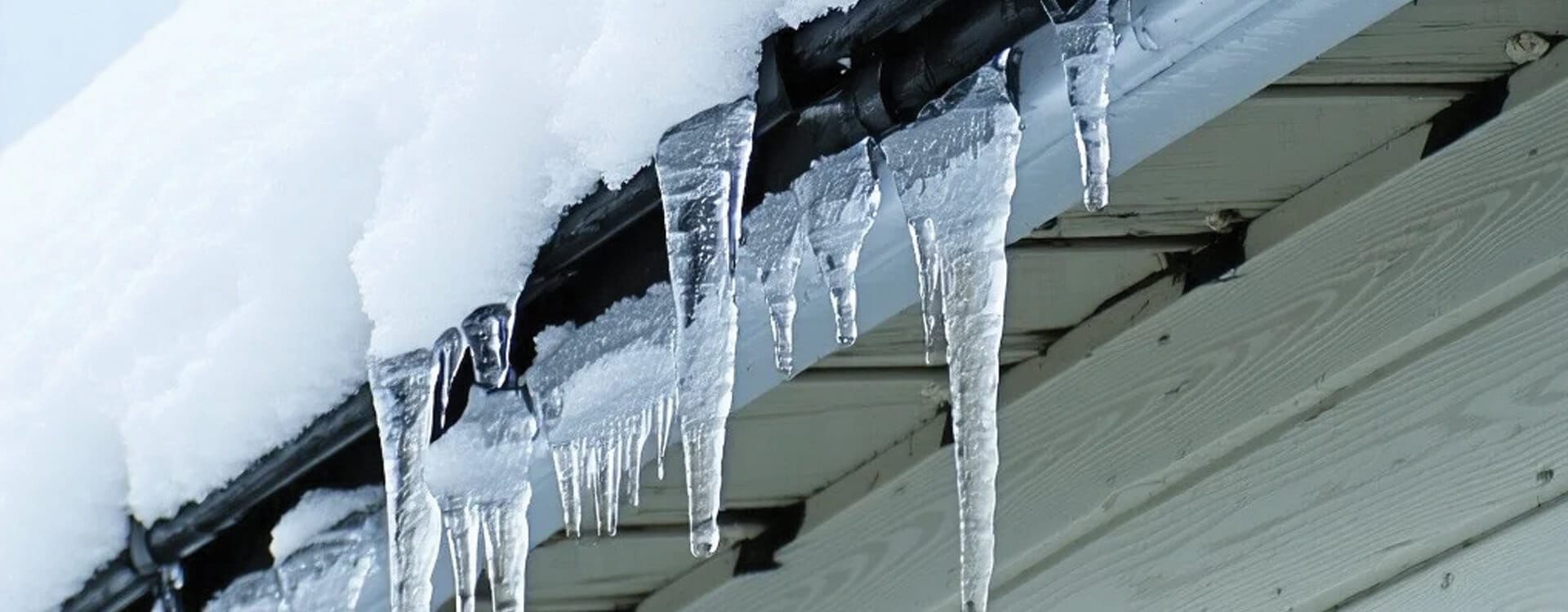 Winter Roof Repair: Ice Dam Removal & Snow Damage Solutions | Synergy ...
